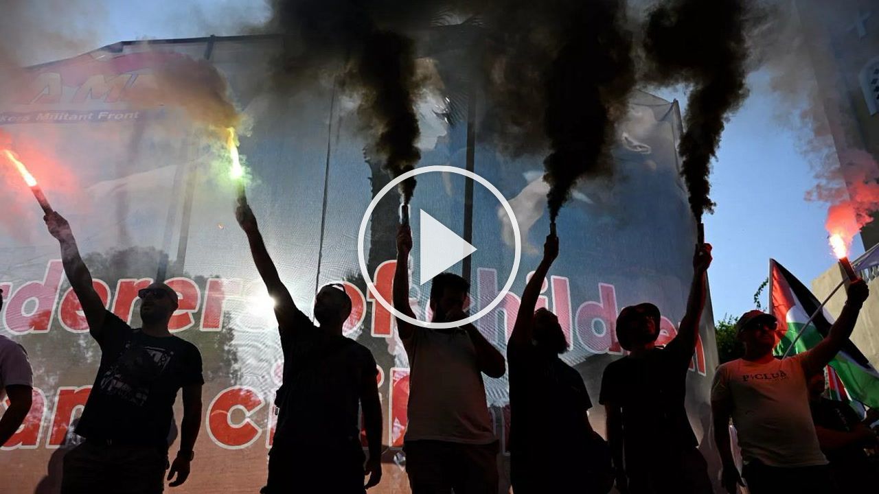 Riot police block protesters from Israeli cruise ship in Greece